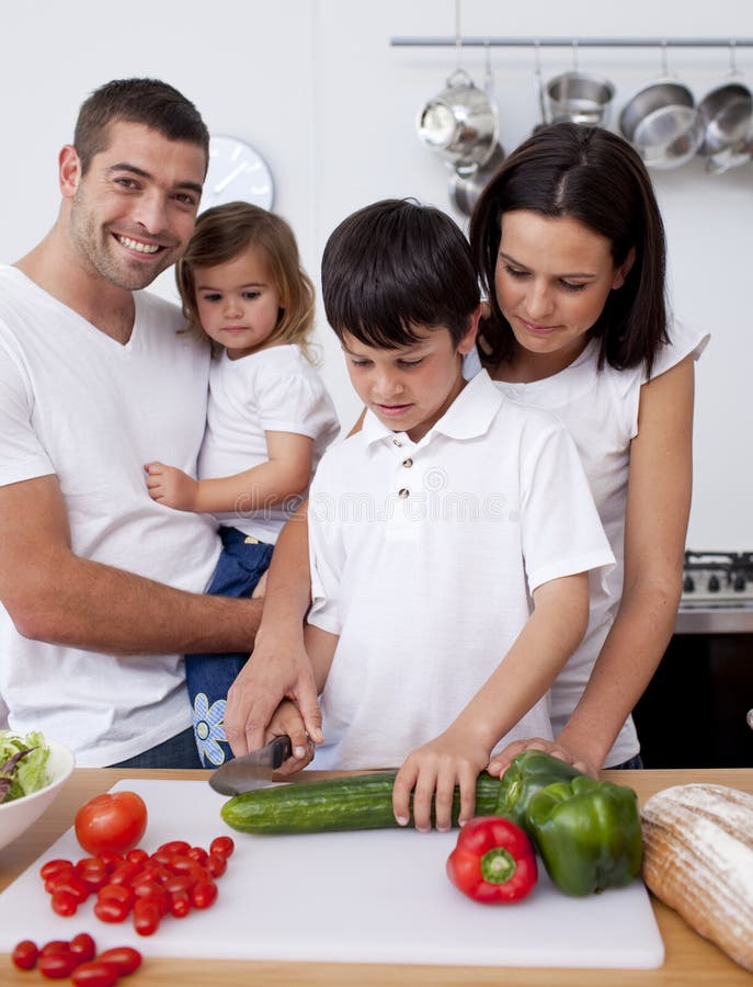 Young Family Cooking Together Stock Photo - Image of daughter, cook ...
