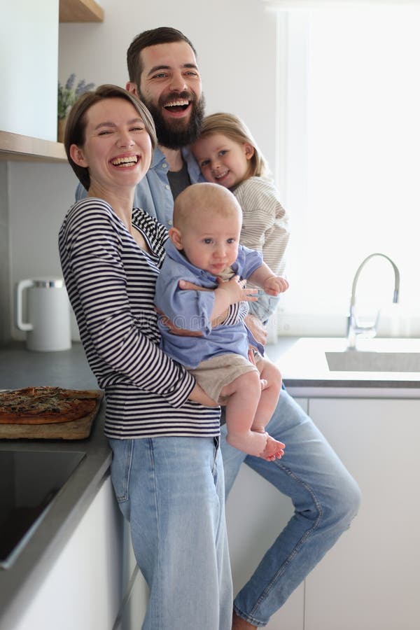 Young Family with Daughter and Son in the Kitchen Stock Image - Image ...