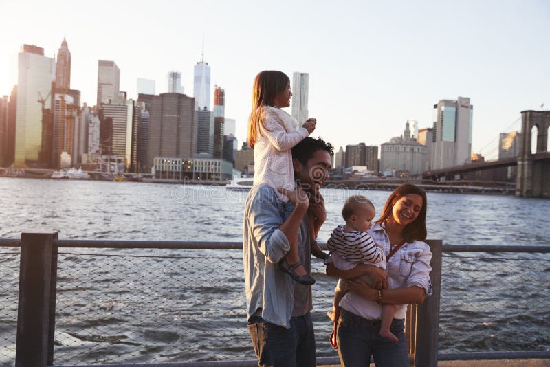 Young Family with Daughters Standing on Quayside, Side View Stock Image ...