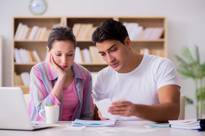 The Young Family Discussing Family Finances Stock Photo - Image of ...