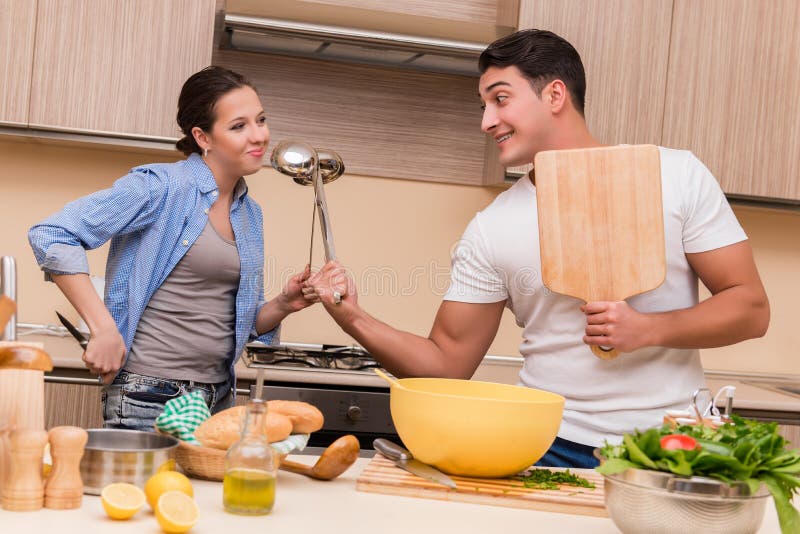 The Young Family Doing Funny Fight at Kitchen Stock Photo - Image of ...