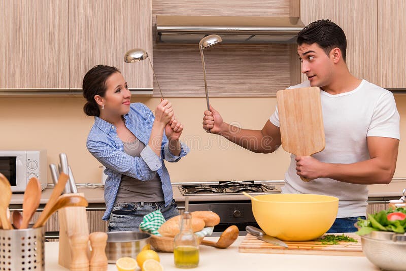 The Young Family Doing Funny Fight at Kitchen Stock Photo - Image of ...