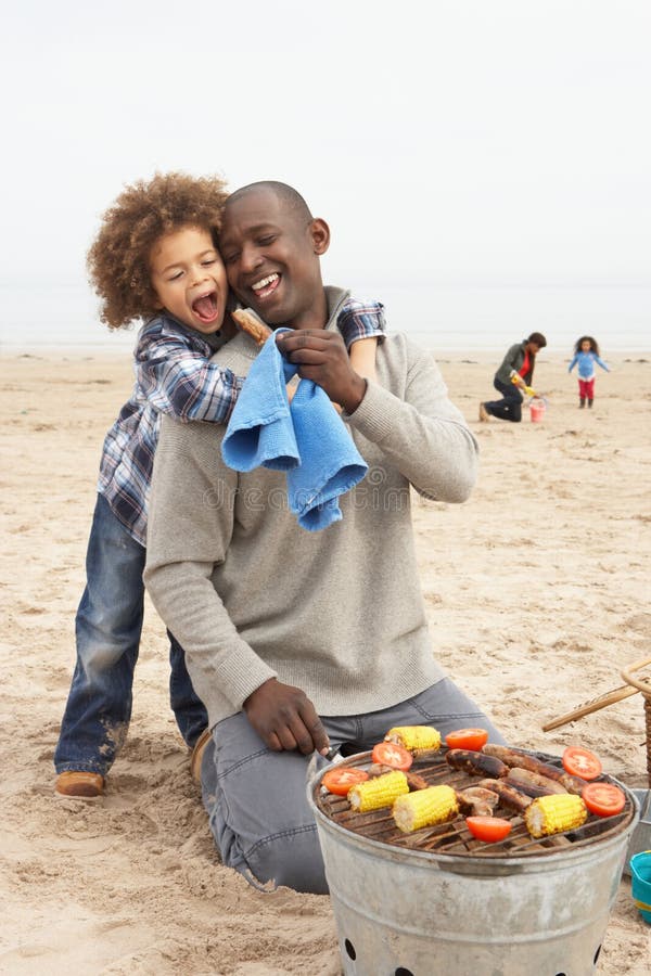 Young Family on Ski Vacation Stock Photo - Image of parents, sitting ...