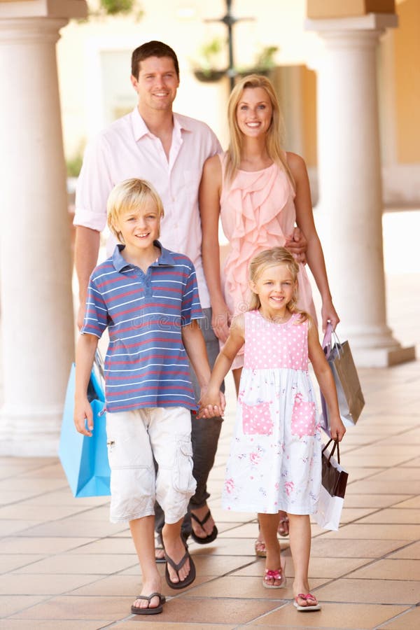 Young Family Enjoying Shopping Trip Stock Image - Image of daughter ...