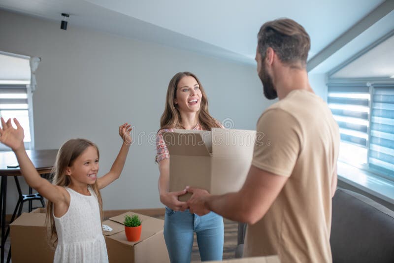 Young Family Feeling Good in Their New Home Stock Image - Image of ...