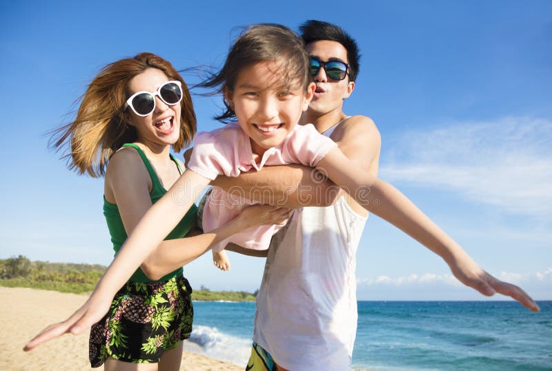 Young Family Having Fun at the Beach Stock Image - Image of relax ...