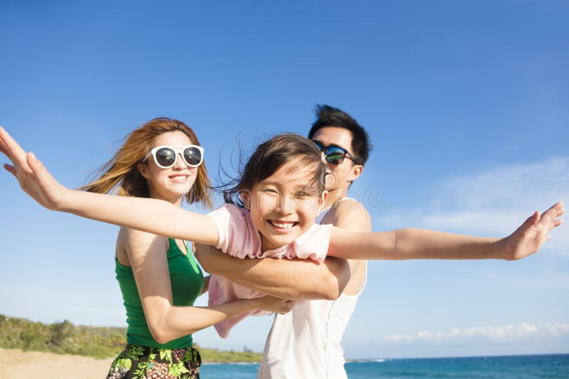 Young Family Having Fun at the Beach Stock Image - Image of happy ...