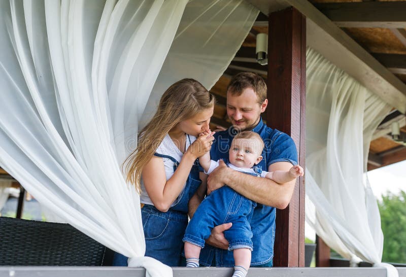 Young Family Having Fun at Home Stock Image - Image of embrace, house ...