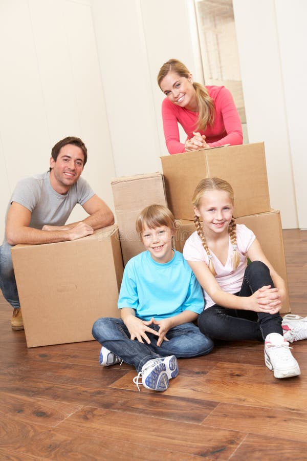 Young Family on Moving Day Looking Happy Stock Image - Image of ...