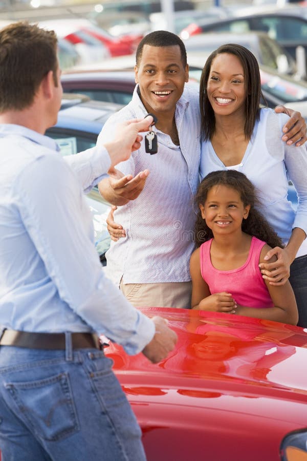 Young Family Picking Up New Car Stock Photo - Image of family, female ...