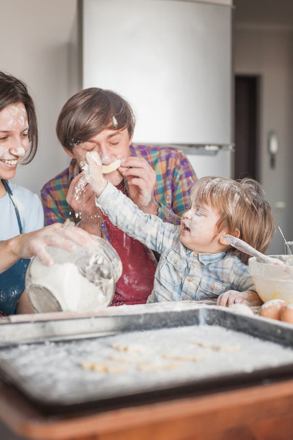 Young Family Playing Flour at Messy Kitchen Stock Image - Image of ...
