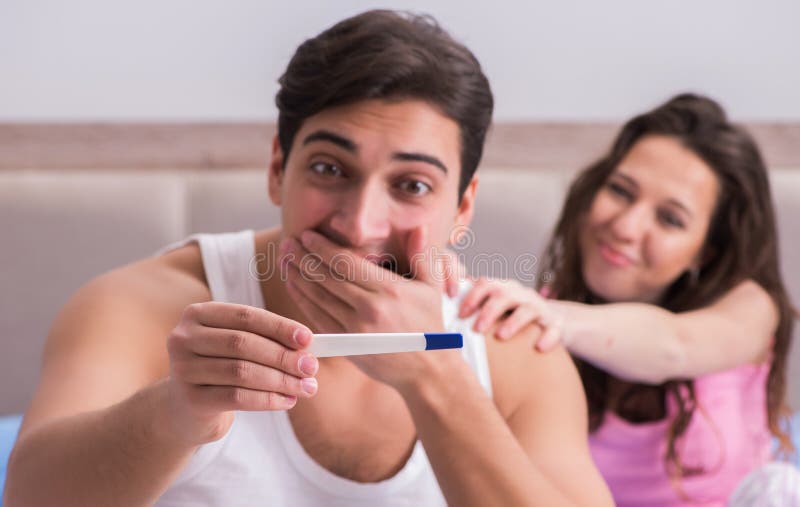 Young Family with Pregnancy Test Results Stock Photo - Image of ...