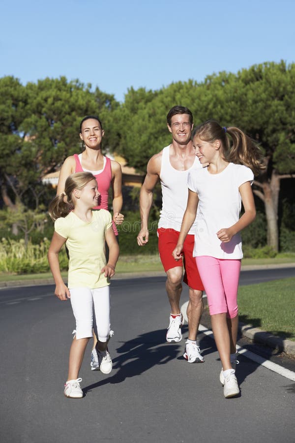 Young Family Running on Road Stock Image - Image of family, sport: 55890689