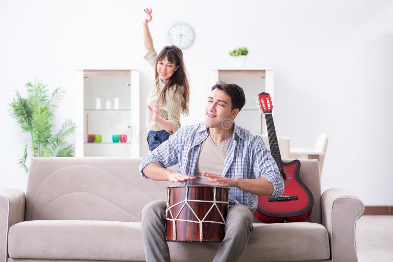 The Young Family Singing and Playing Music at Home Stock Photo - Image ...