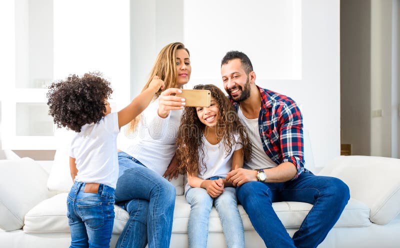 Young Family Sitting on the Couch Stock Image - Image of mother ...