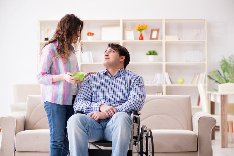 The Young Family Taking Care of Each Other Stock Image - Image of chair ...