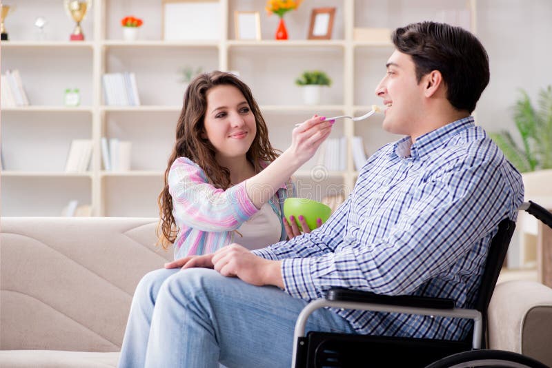 The Young Family Taking Care of Each Other Stock Image - Image of carer ...