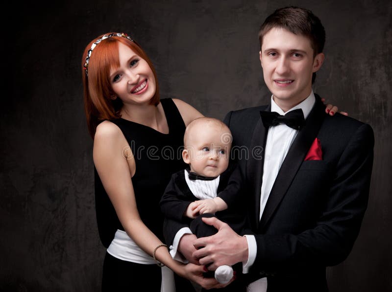 Young Family with Their Son between Them Stock Photo - Image of family ...