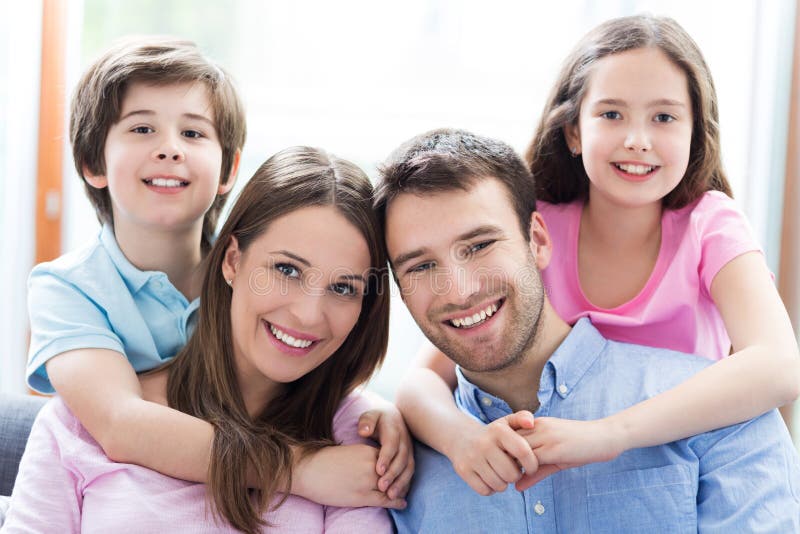Young family with two kids stock image. Image of inside - 54587997