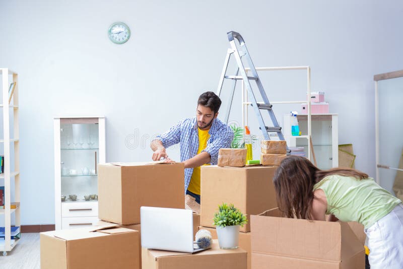 The Young Family Unpacking at New House with Boxes Stock Photo - Image ...