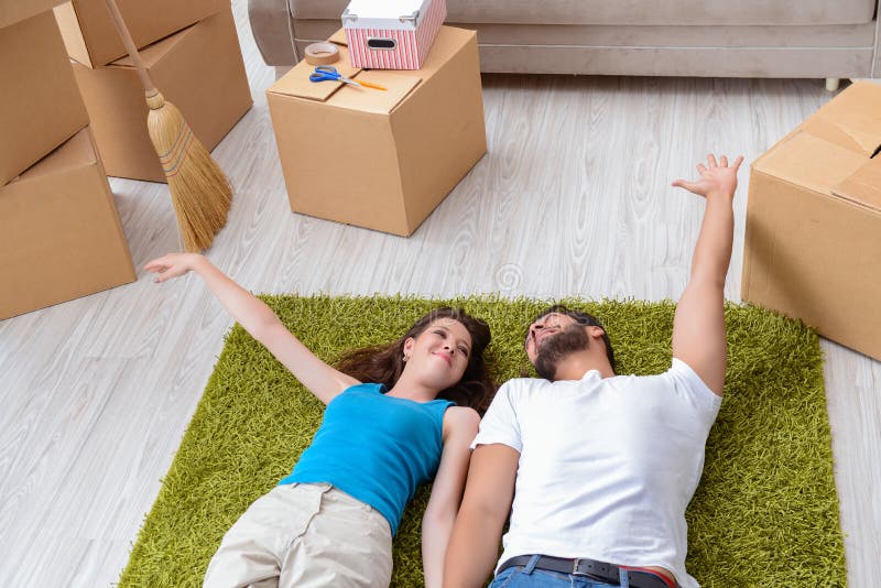The Young Family Unpacking at New House with Boxes Stock Photo - Image ...