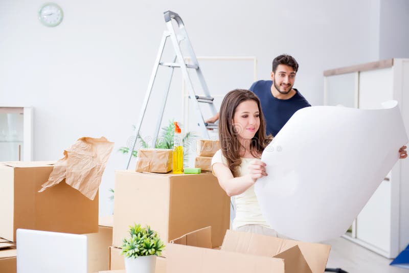 The Young Family Unpacking at New House with Boxes Stock Image - Image ...