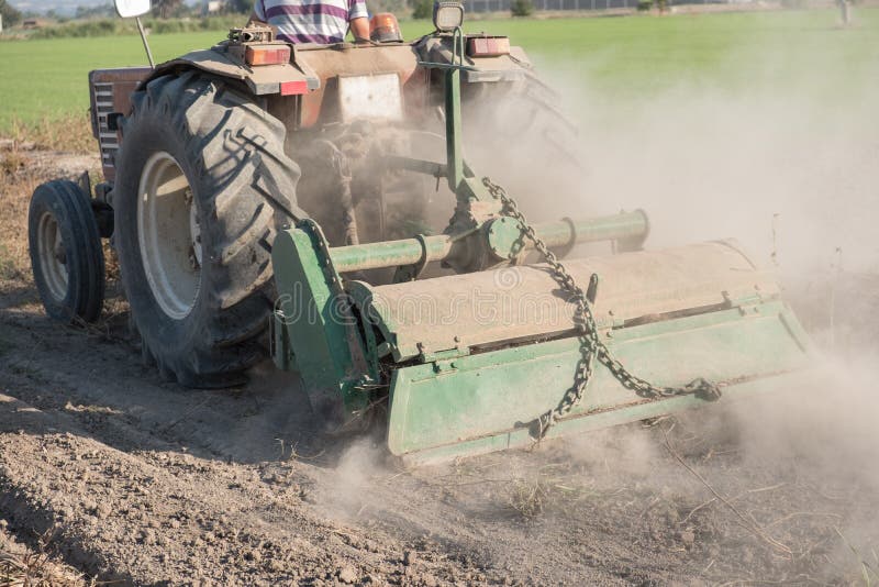 Young Farmer on His Tractor Wrapped in Dust Stock Image - Image of ...