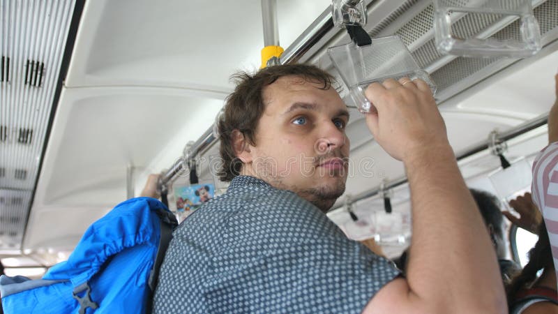 Young Fat Bearded Handsome Man With Backpack Travels At Metro Train ...