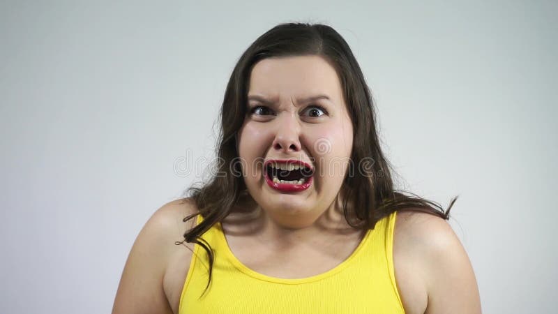 Young Fat Woman Considers in the Reflection His Cheeks, Double Chin and ...