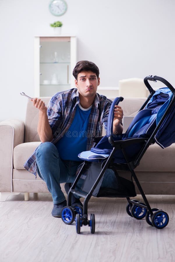 The Young Father Assembling Baby Pram at Home Stock Image - Image of ...