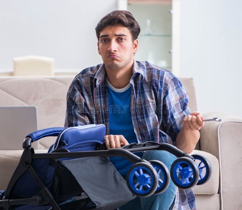 Young Father Assembling Baby Pram at Home Stock Photo - Image of fixing ...