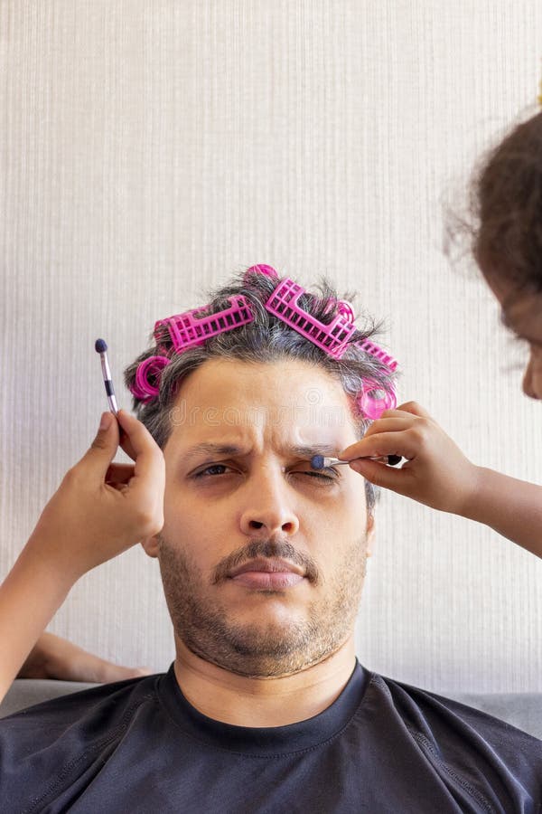 Handsome Father is Being Makeup by the Hands of His Daughters Stock ...