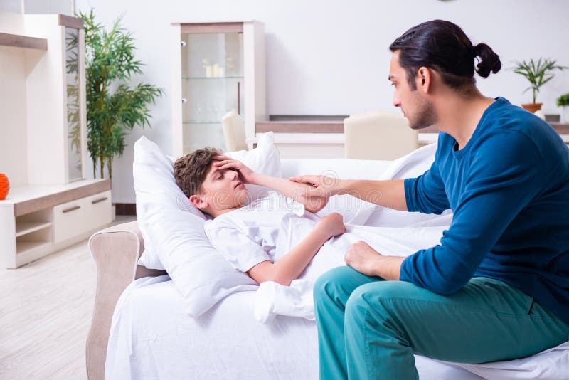 Young Father Caring for Sick Son Stock Image - Image of frustrated ...