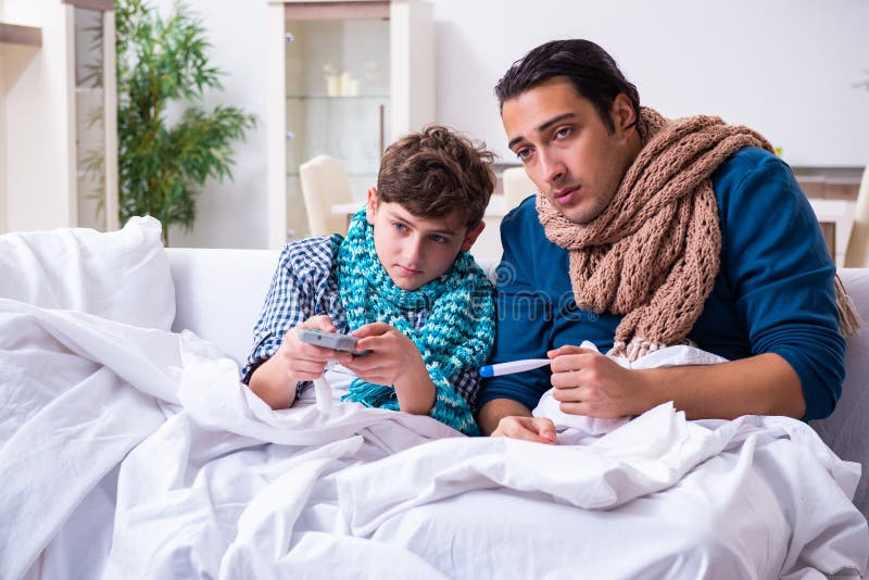 Young Father Caring for Sick Son Stock Image - Image of healthcare ...