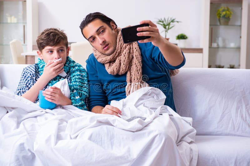 Young Father Caring for Sick Son Stock Image - Image of medical ...