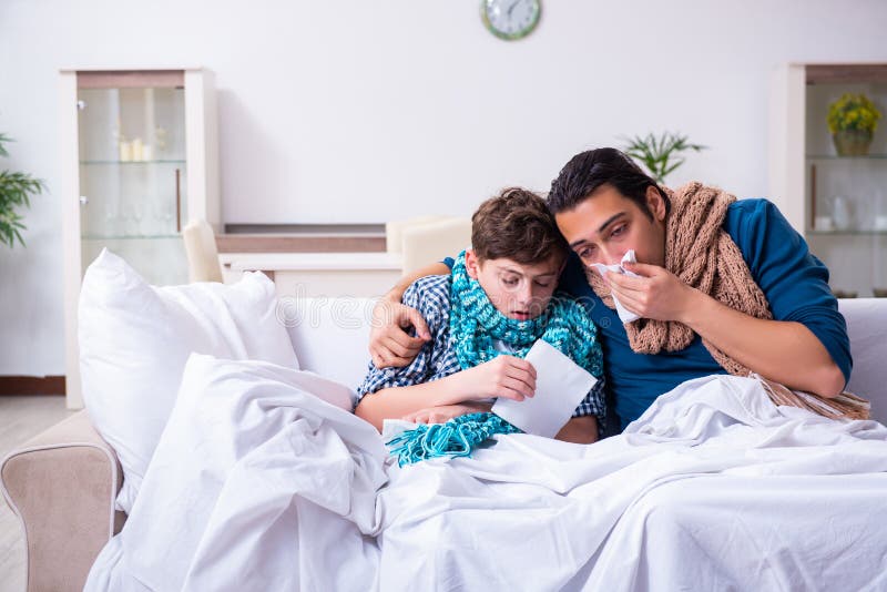 Young Father Caring for Sick Son Stock Photo - Image of medical ...