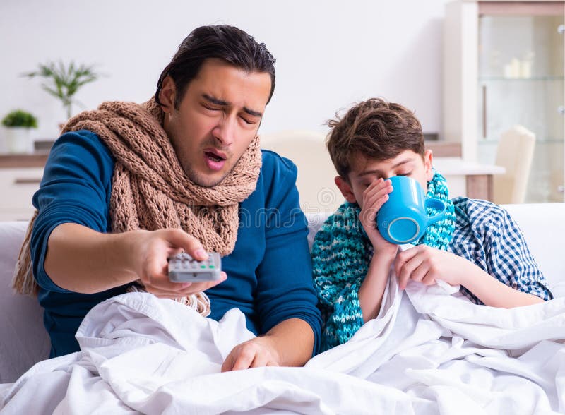 Young Father Caring for Sick Son Stock Photo - Image of epidemic, fever ...