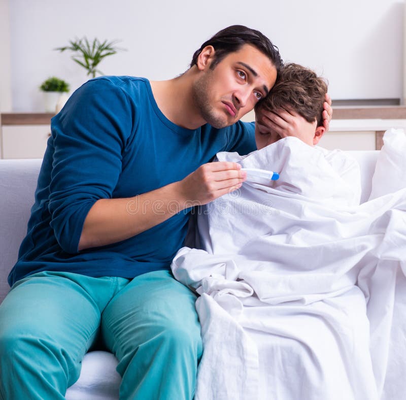 Young Father Caring for Sick Son Stock Photo - Image of allergy ...