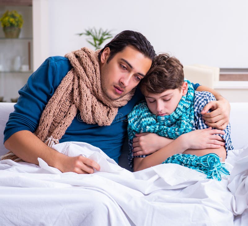 Young Father Caring for Sick Son Stock Photo - Image of seasonal, pain ...