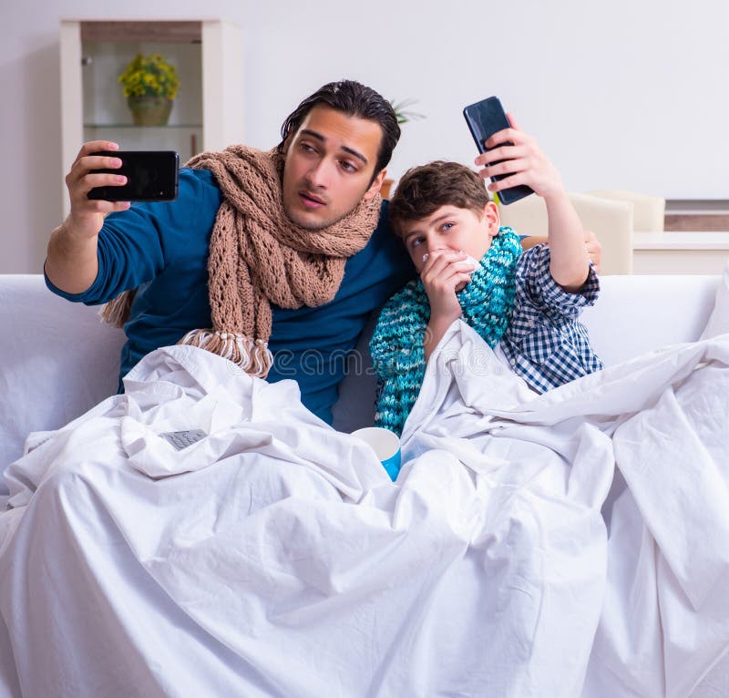 Young Father Caring for Sick Son Stock Image - Image of disease, family ...