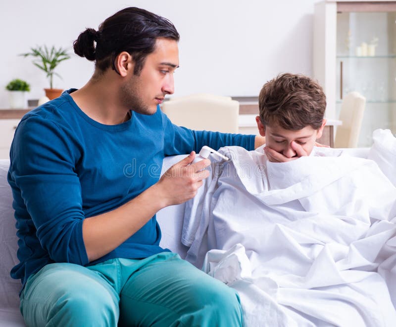 Young Father Caring for Sick Son Stock Image - Image of cold, care ...