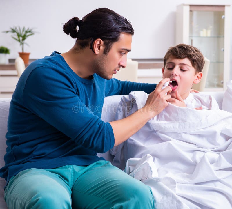 Young Father Caring for Sick Son Stock Photo - Image of high, aerosol ...