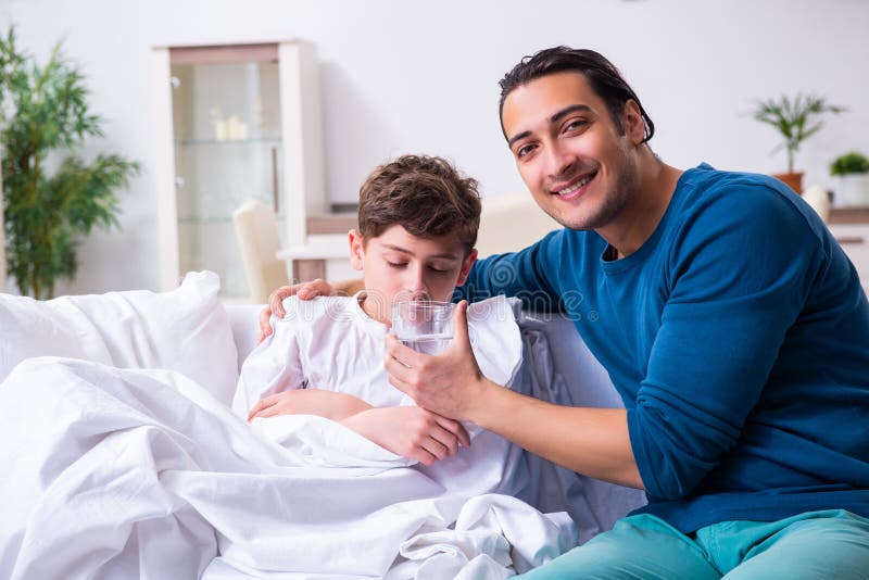 Young Father Caring for Sick Son Stock Photo - Image of allergy ...