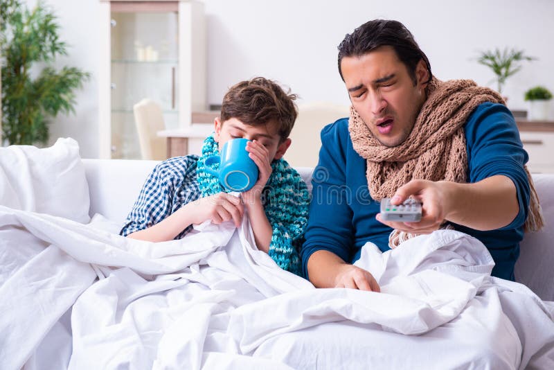 Young Father Caring for Sick Son Stock Image - Image of sneezing, home ...