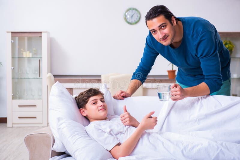 Young Father Caring for Sick Son Stock Photo - Image of recovery ...