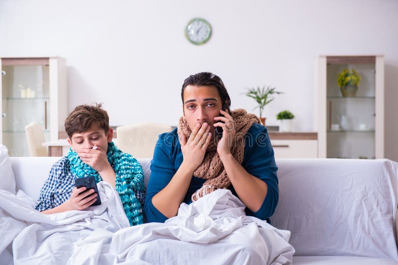 Young Father Caring for Sick Son Stock Photo - Image of prevention ...