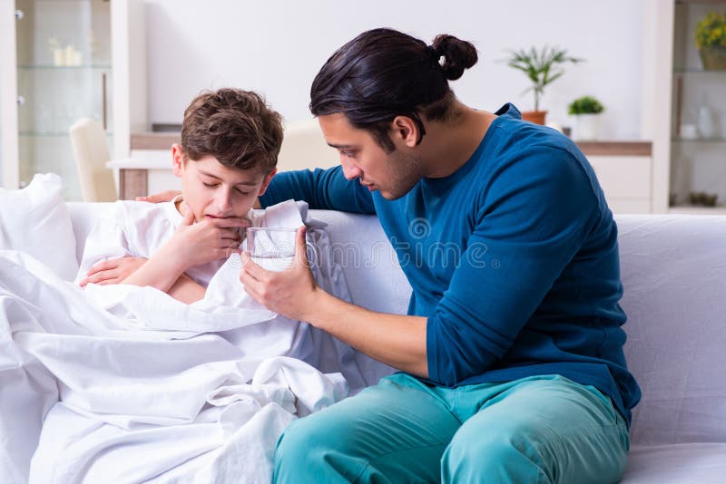 Young Father Caring for Sick Son Stock Image - Image of infection ...
