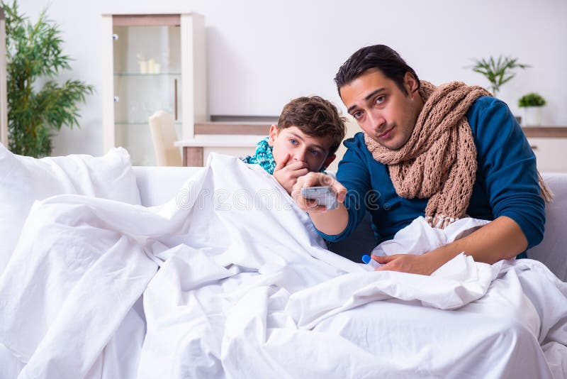 Young Father Caring for Sick Son Stock Photo - Image of sickness ...