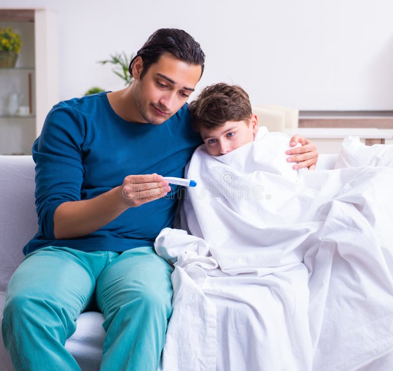 Young Father Caring for Sick Son Stock Image - Image of influenza, sick ...