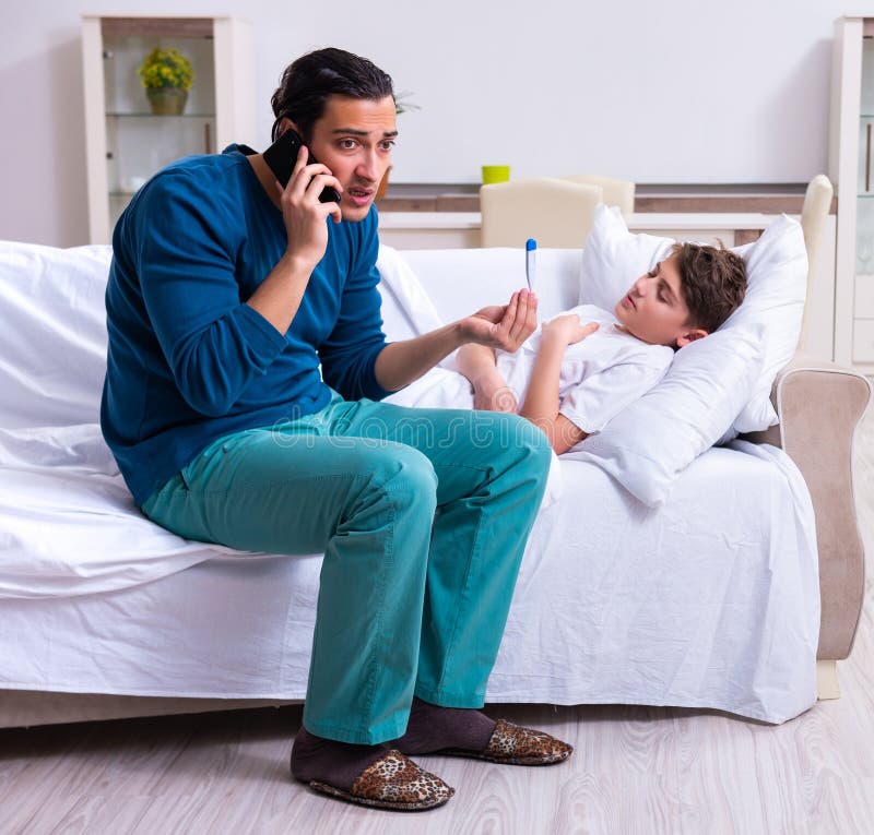 Young Father Caring for Sick Son Stock Photo - Image of pain, father ...